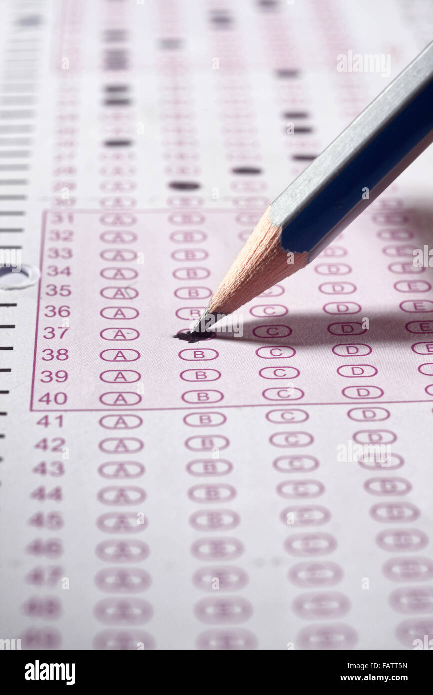 pencil on the exam paper Stock Photo - Alamy
