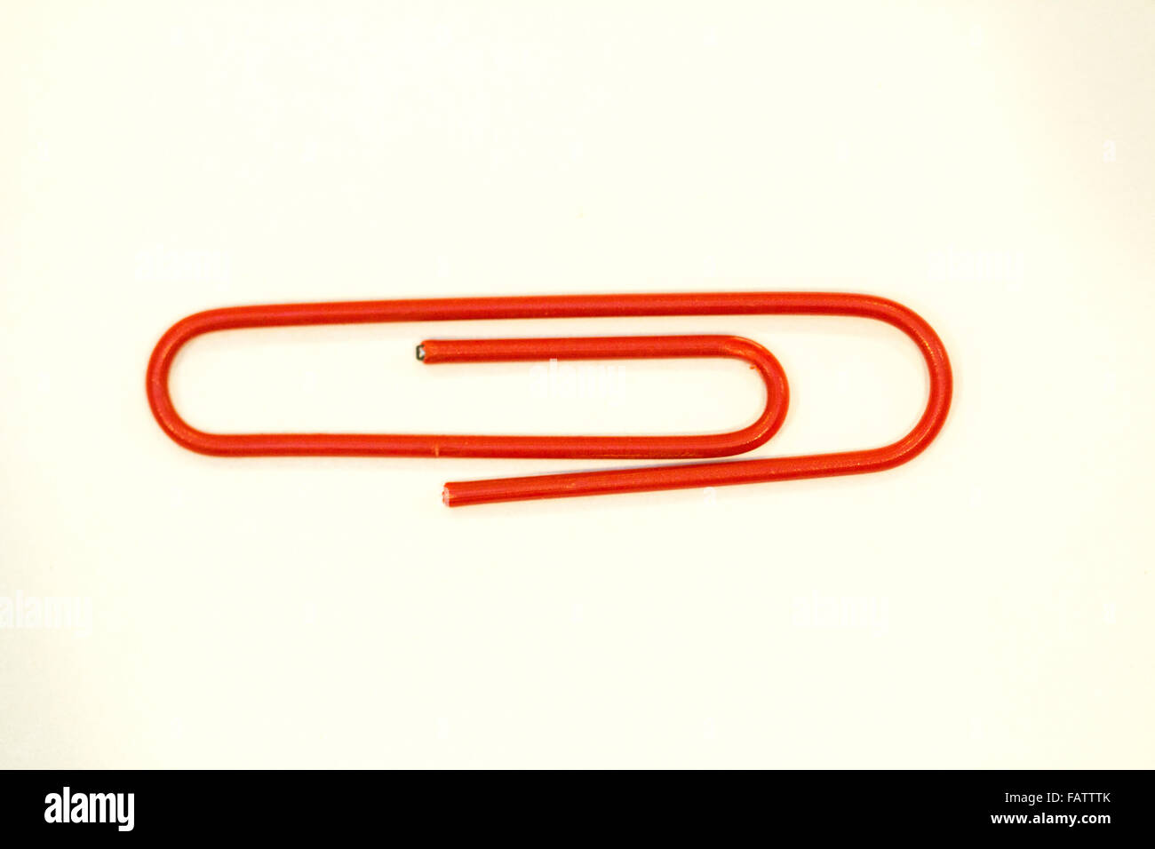 A red paper clip Stock Photo - Alamy