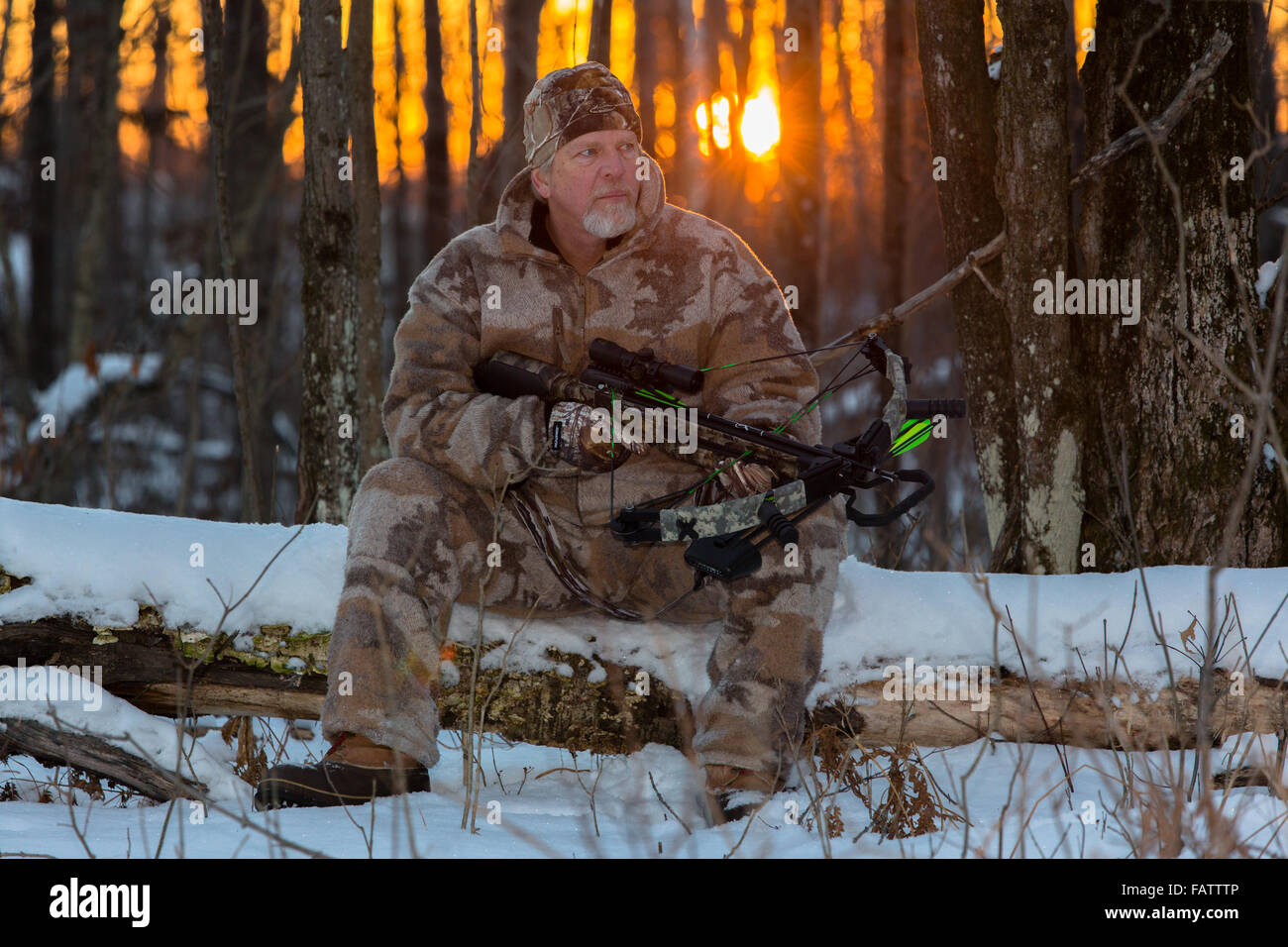 Hunter sitting on log hi-res stock photography and images - Alamy