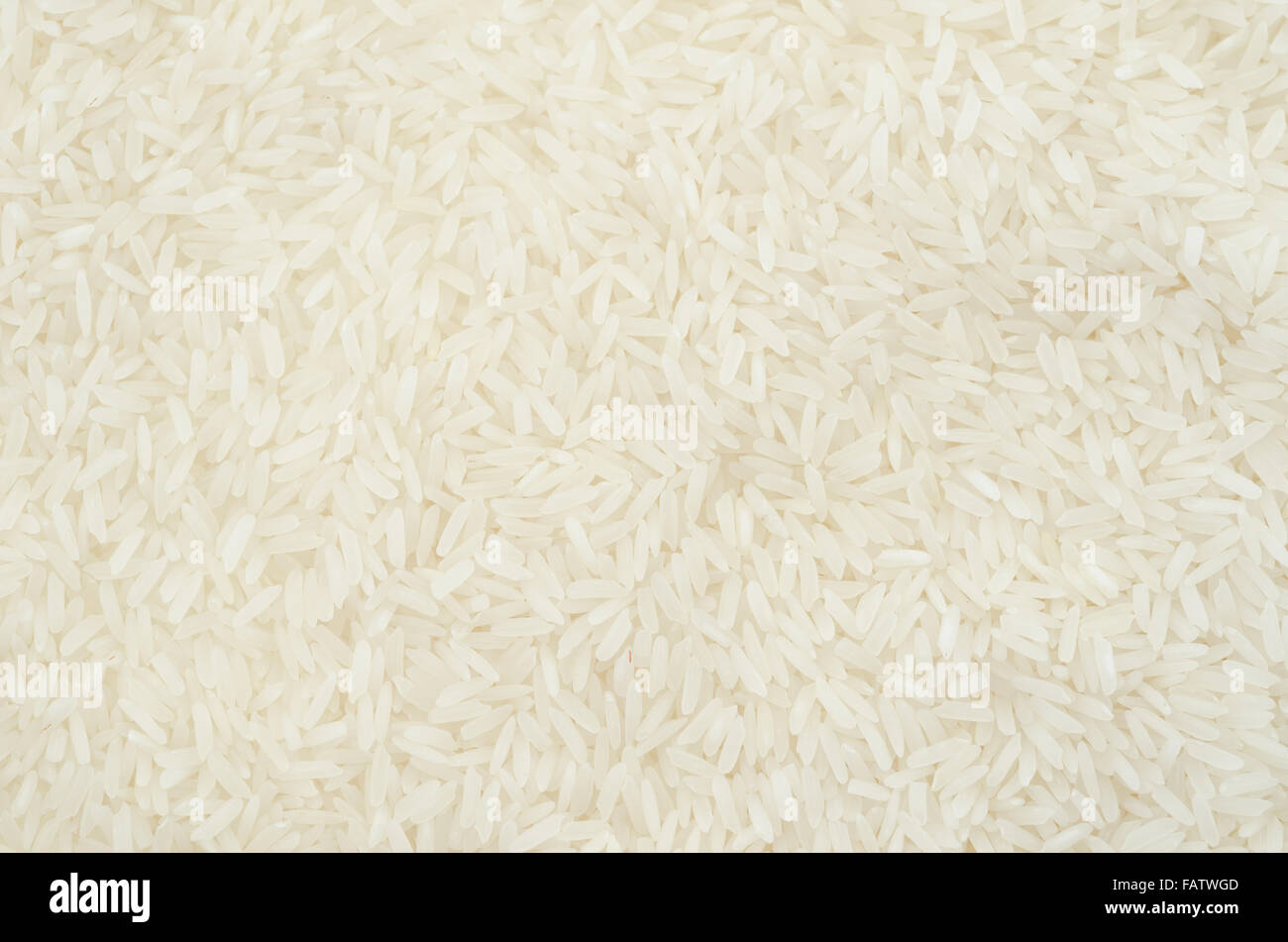 Raw white rice texture as background Stock Photo - Alamy