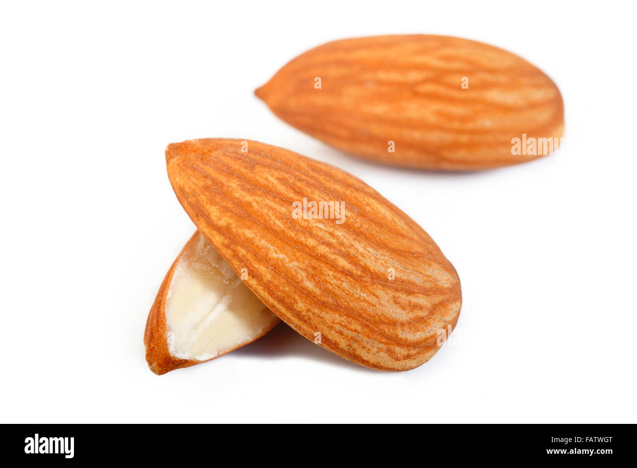 raw almond nuts isolated on white background Stock Photo - Alamy