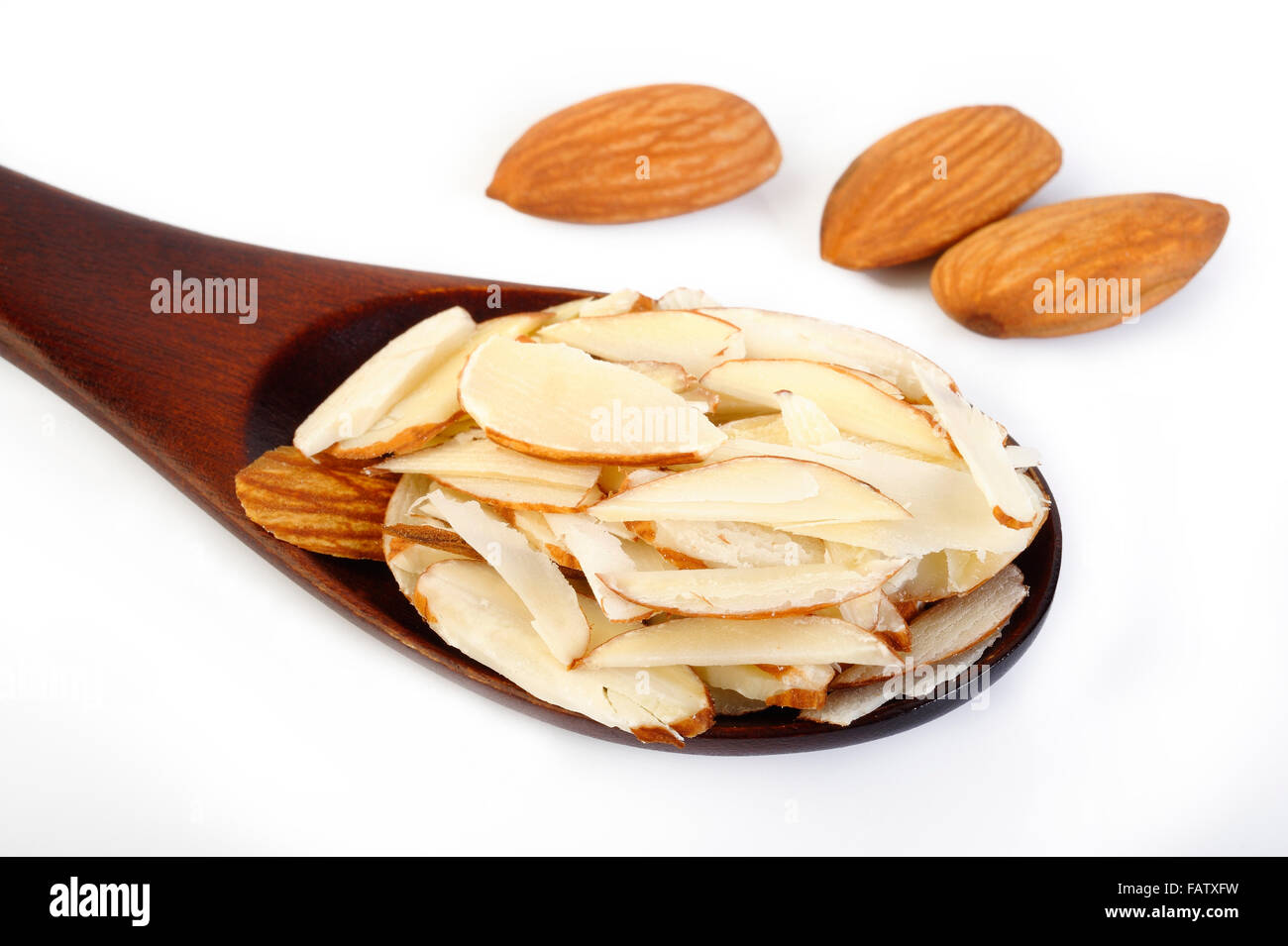 Sliced almonds in a wooden spoon Stock Photo - Alamy