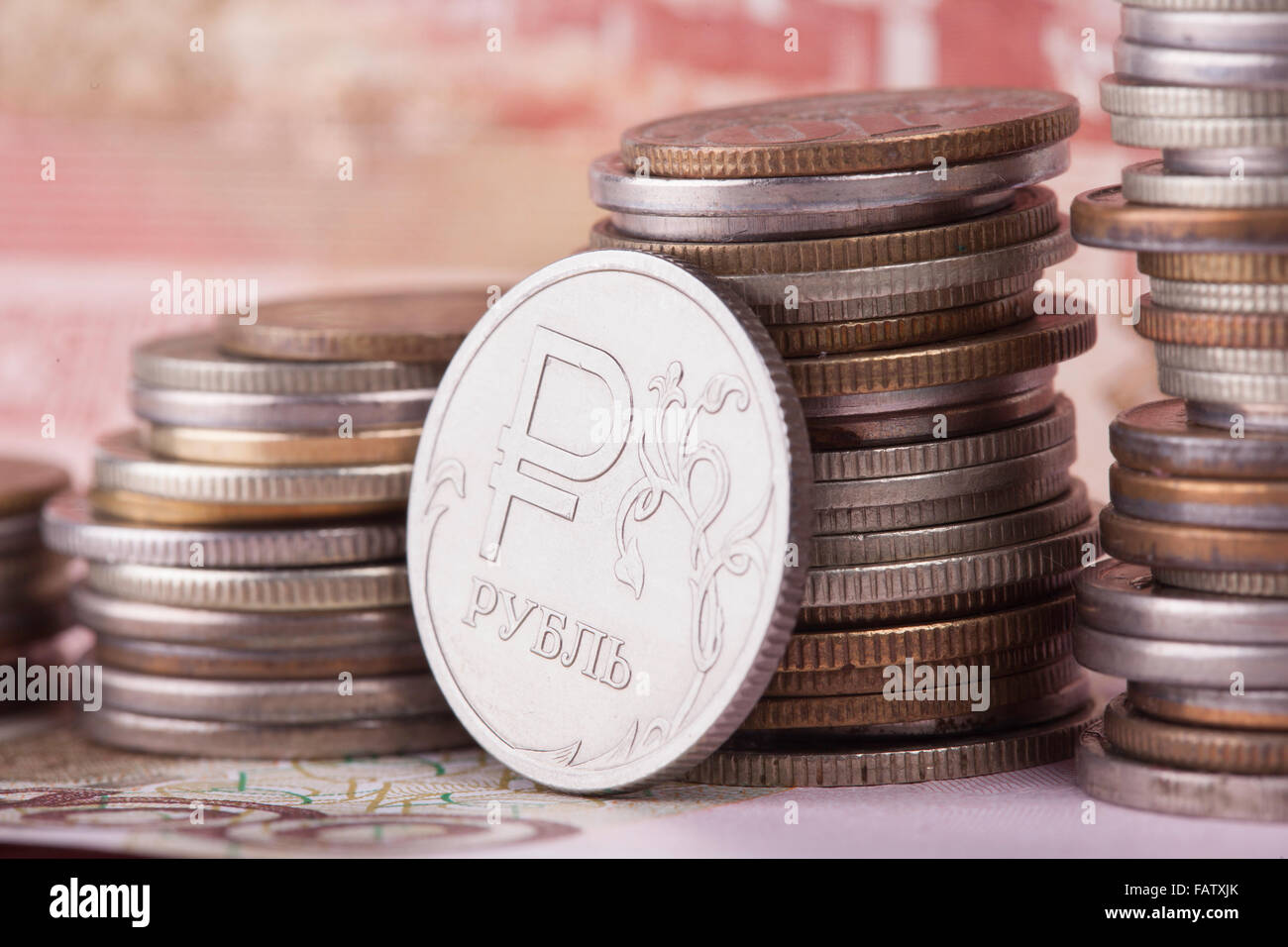 coin ruble on the background of banknotes and money stacks Stock Photo ...