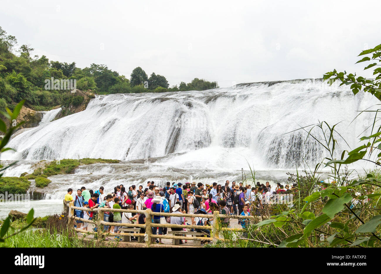 Anshun, China's Guizhou Province. 10th Aug, 2015. Tourists watch a ...