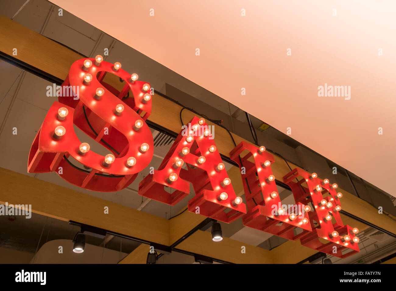 Vintage sale sign with light bulbs hanging on the roof Stock Photo - Alamy