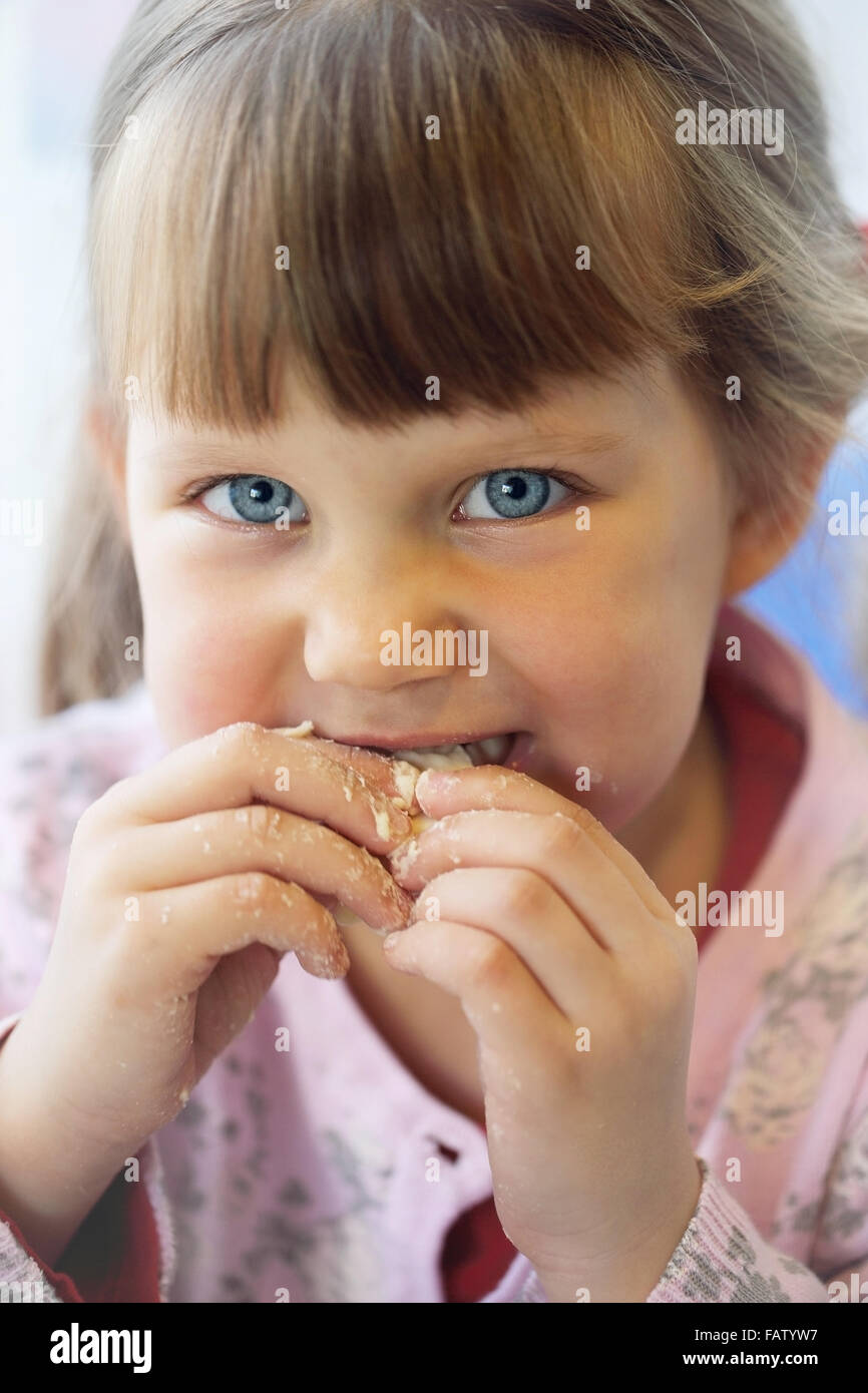 portrait, girl eating pastry Stock Photo - Alamy