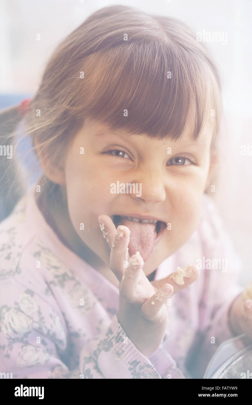 girl eating pastry Stock Photo - Alamy