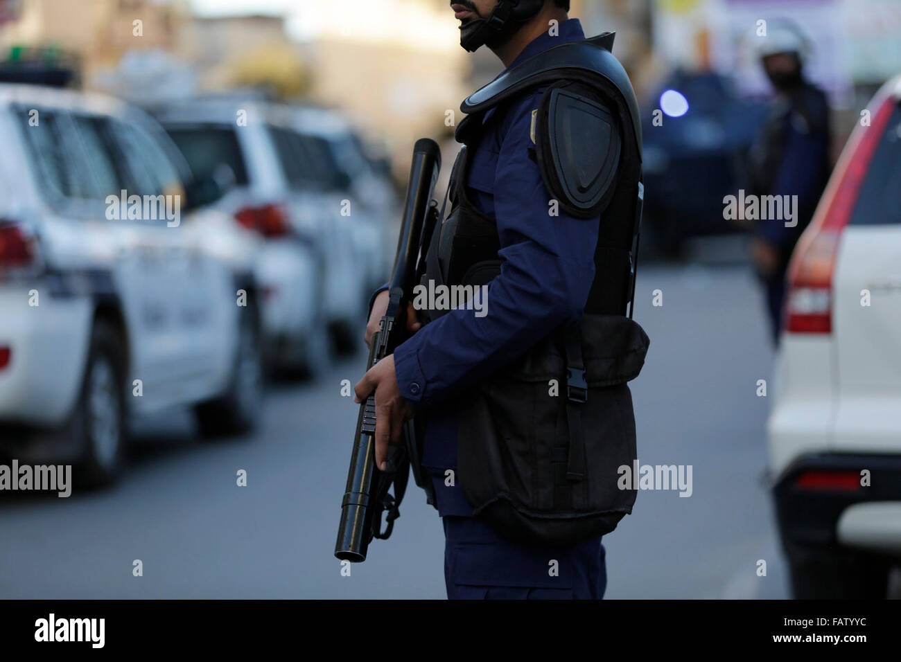 Daih, Bahrain. 5th January, 2016. A riot policeman stands guard in Daih ...