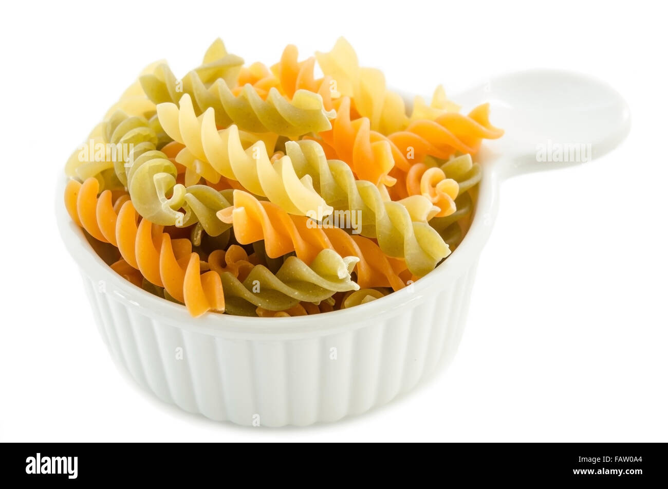 dried italian pasta (macaroni) in white bowl on white background Stock ...