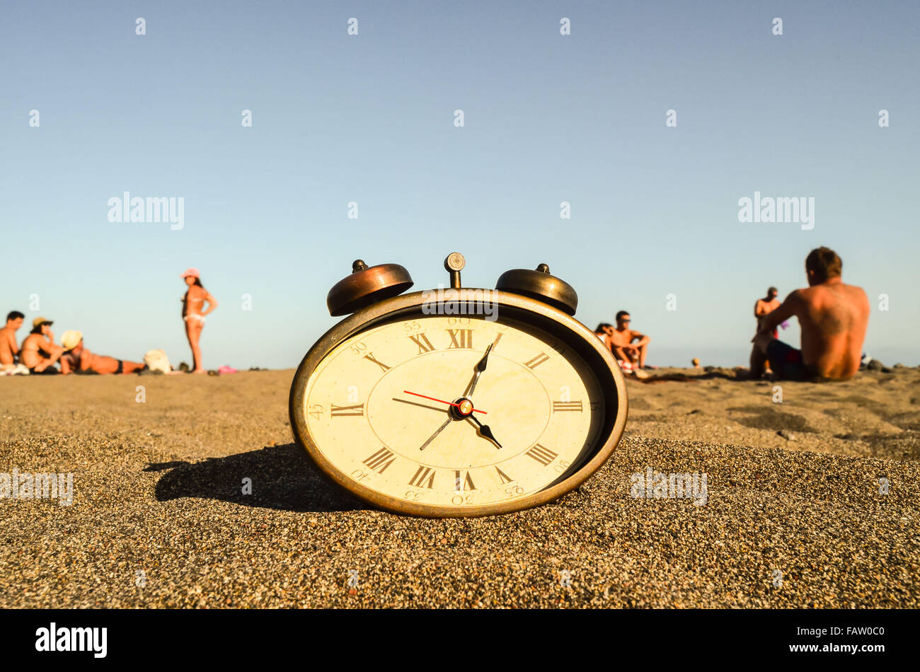 Clock on the Sand Beach Stock Photo - Alamy