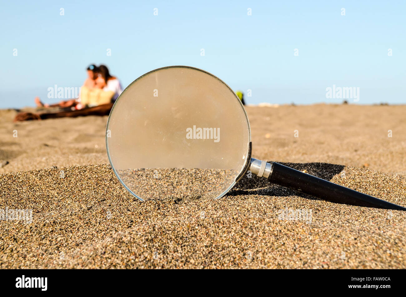 Magnify Glass on the Sand Beach Stock Photo - Alamy