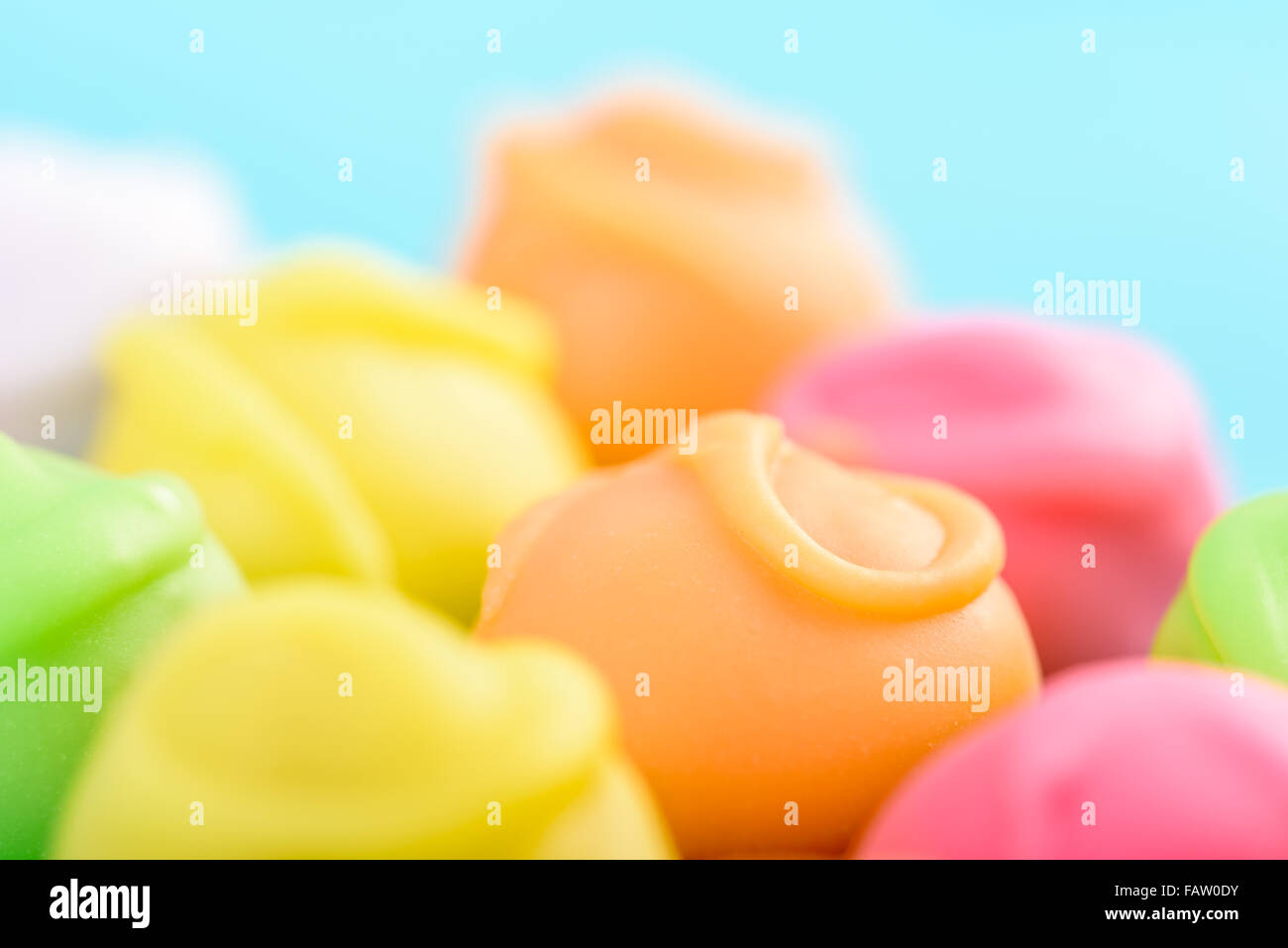 Fondant Candies On Turquoise Background Stock Photo - Alamy