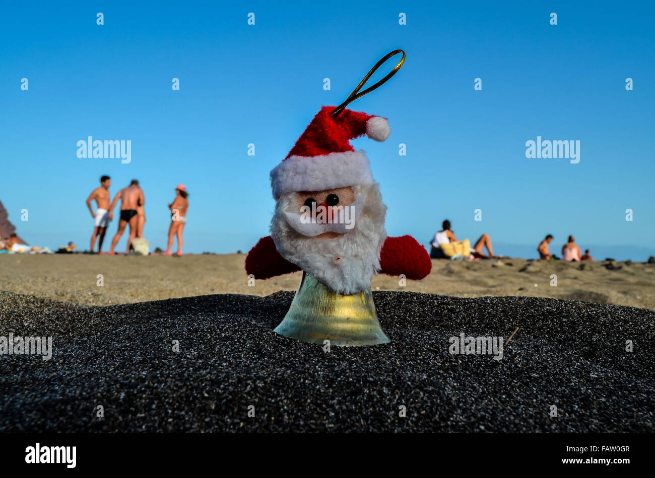 Santa Claus Toy on the Sand Beach Stock Photo - Alamy