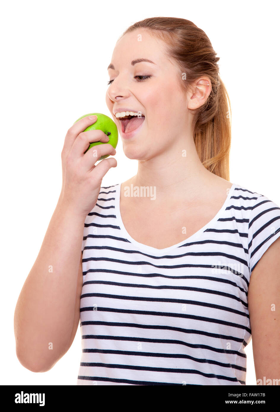 Young woman eating green apple. All on white background Stock Photo - Alamy