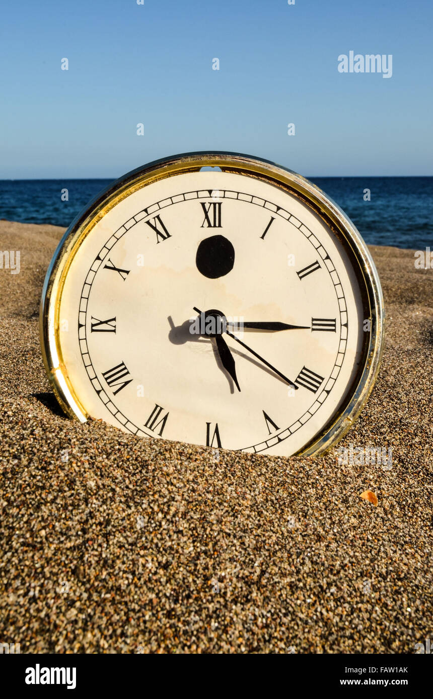 Clock on the Sand Beach Stock Photo - Alamy