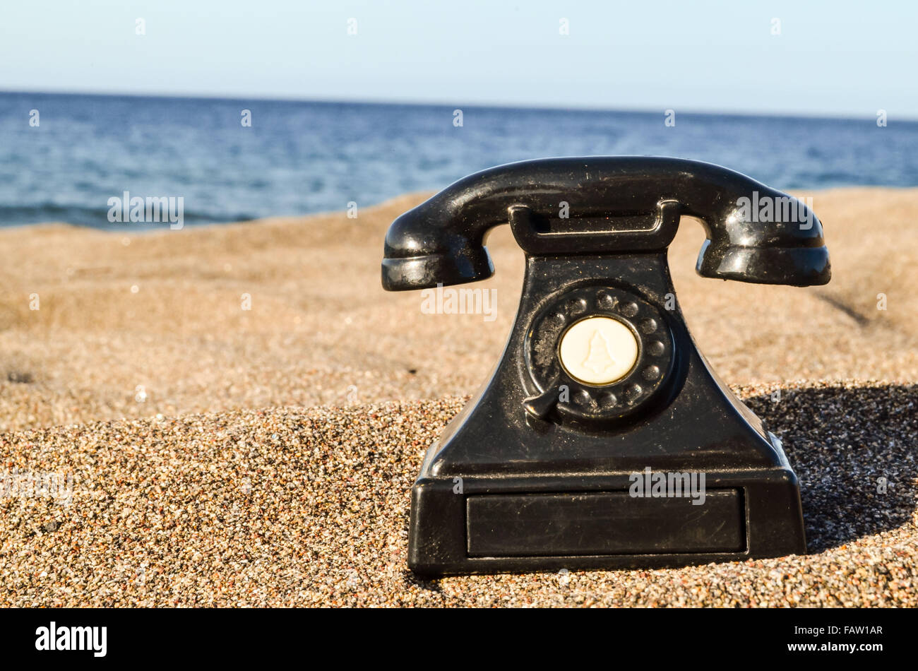 Phone on the Sand Beach Stock Photo - Alamy