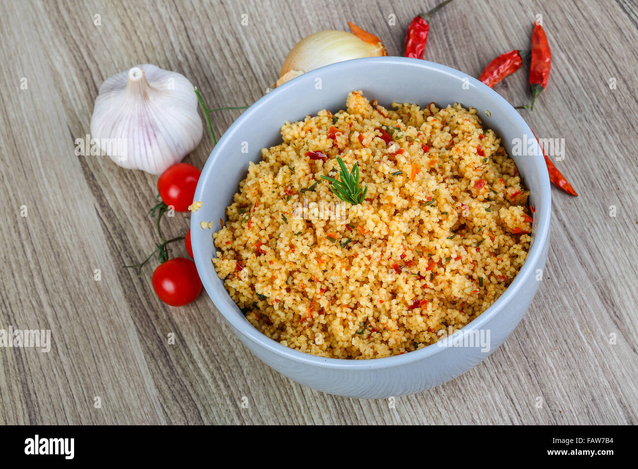 Arabic traditional cuisine - Couscous with tomato and green onion Stock ...