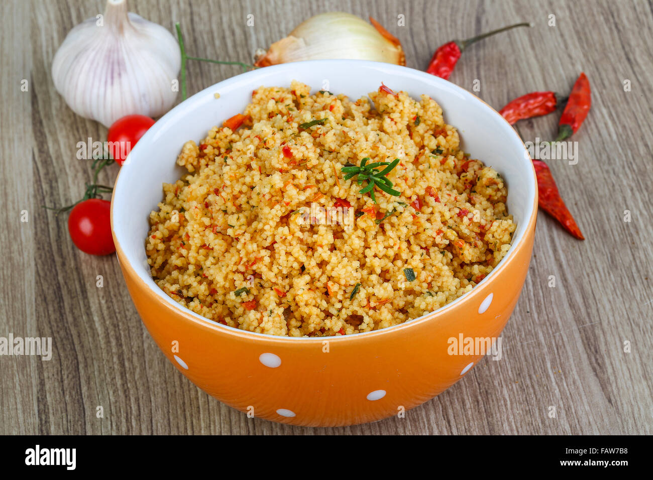 Arabic traditional cuisine - Couscous with tomato and green onion Stock ...