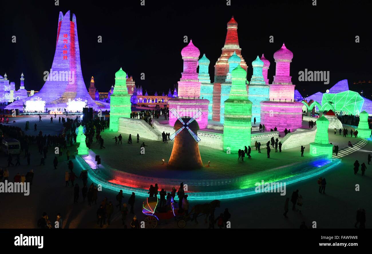 Harbin. 5th Jan, 2016. Tourists wonder around ice sculptures as the ...