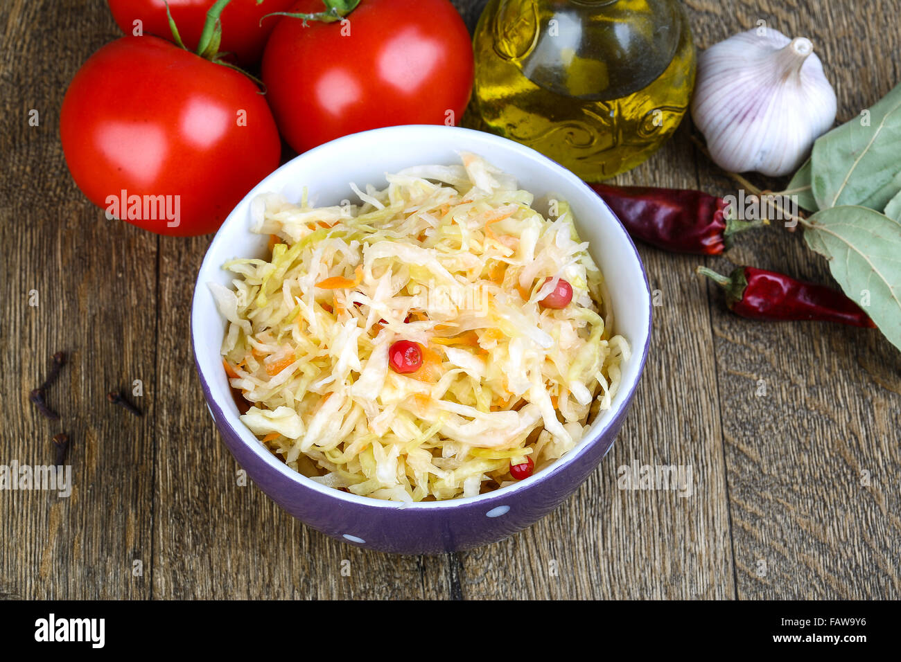 Fermented cabbage - Sauerkraut with herbs and spices on the wood ...