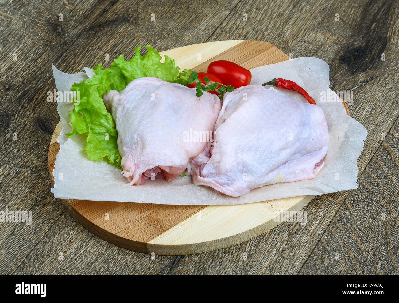 Raw chicken legs meat with herbs and spices ready for cooking Stock ...