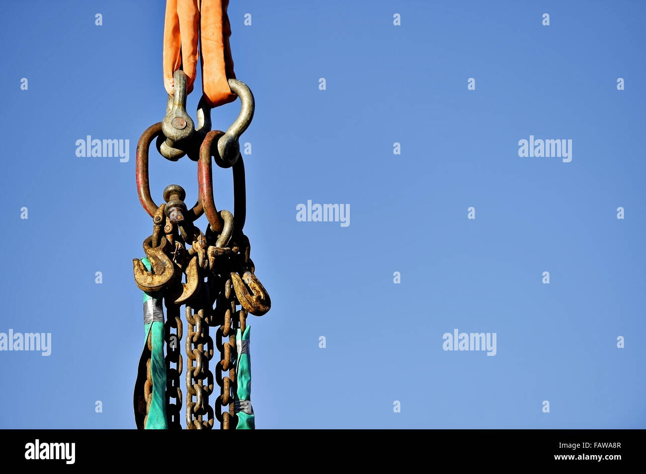 Heavy duty industrial chain hooked up on a construction crane Stock ...