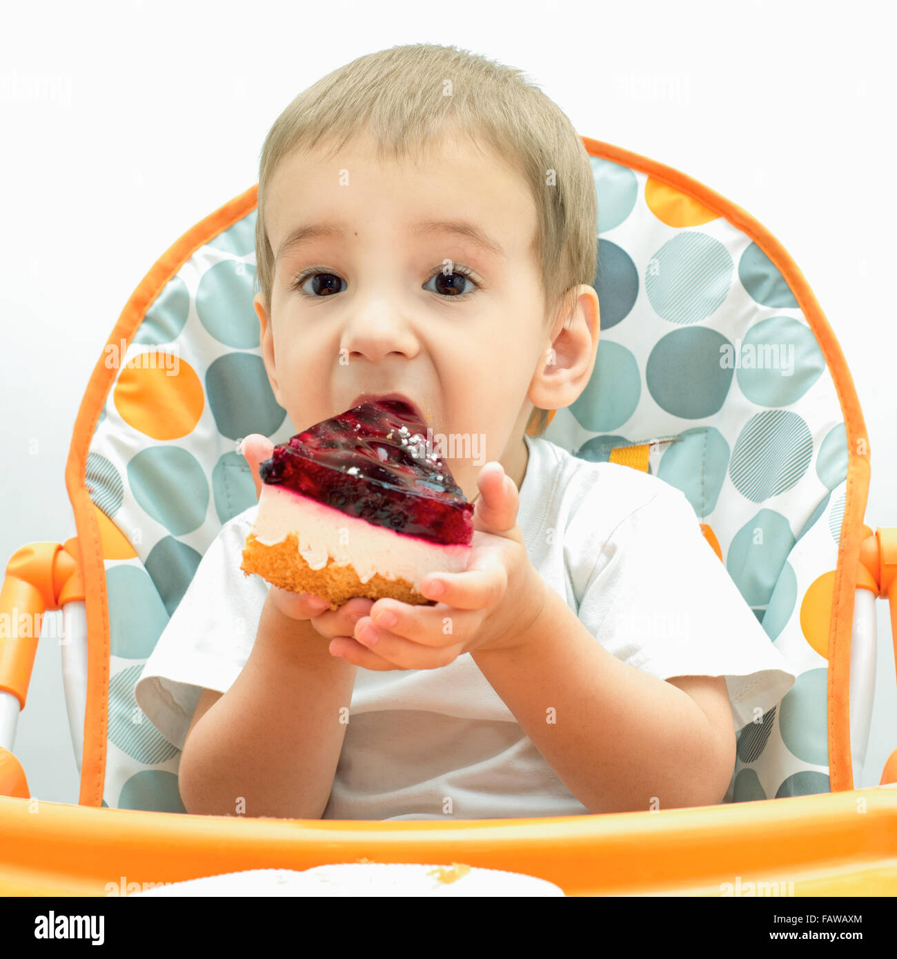 Little boy eats cake Stock Photo - Alamy
