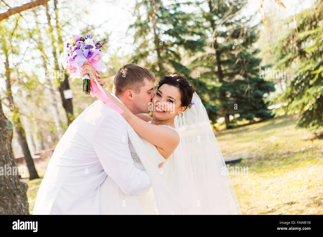 wedding couple hugging Stock Photo - Alamy
