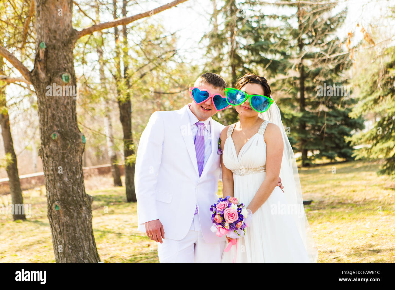 young wedding couple in funny big glasses Stock Photo - Alamy