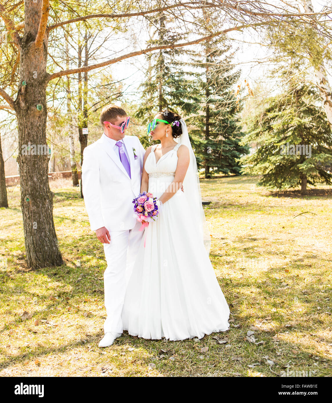 young wedding couple in funny big glasses Stock Photo - Alamy