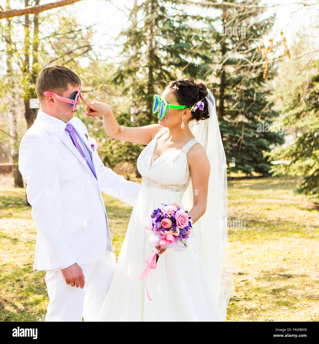 young wedding couple in funny big glasses Stock Photo - Alamy