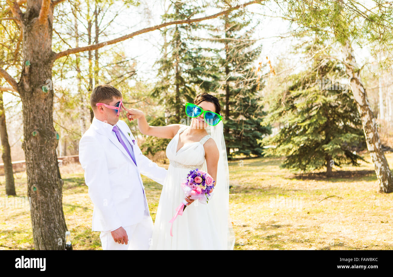 young wedding couple in funny big glasses Stock Photo - Alamy