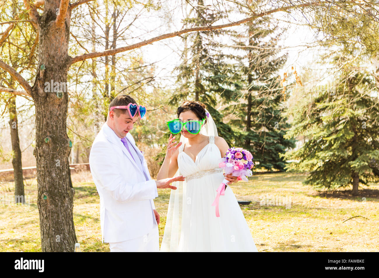 young wedding couple in funny big glasses Stock Photo - Alamy