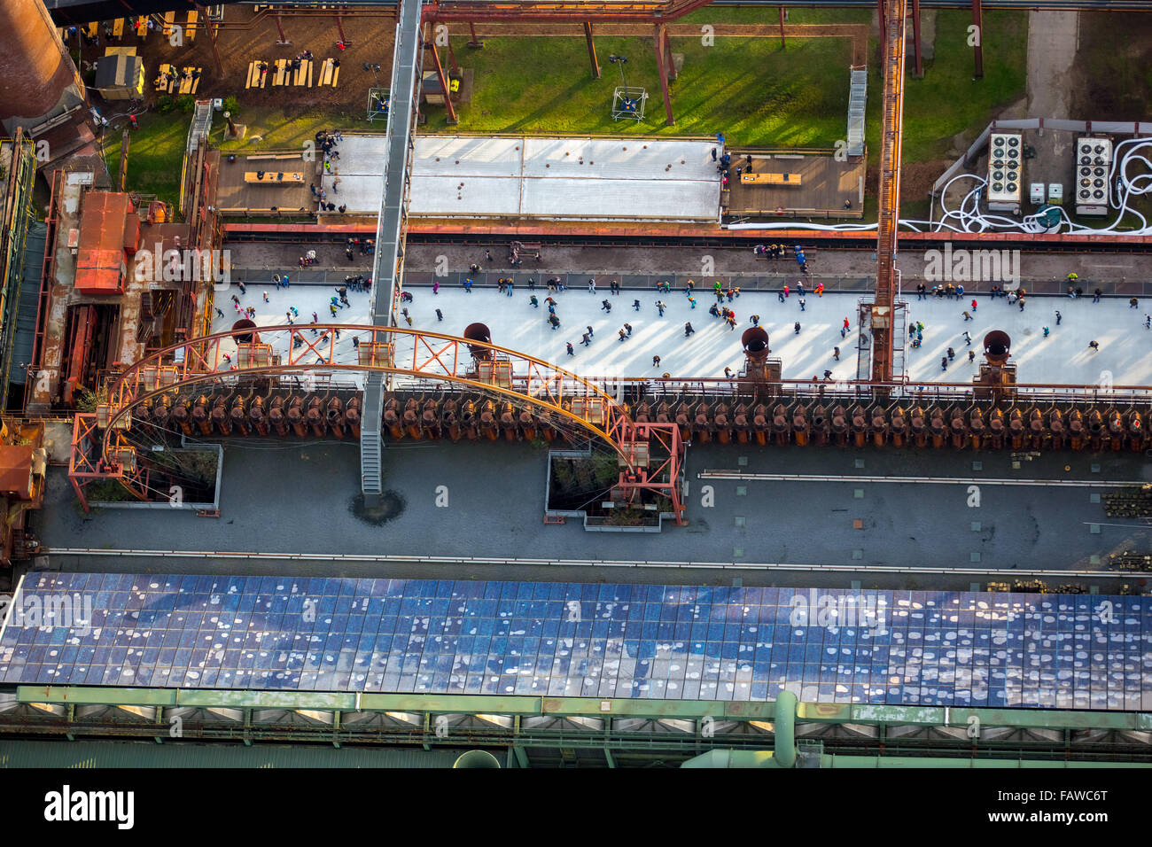 Skating rink in the coking plant Zollverein colliery with sun wheel at ...