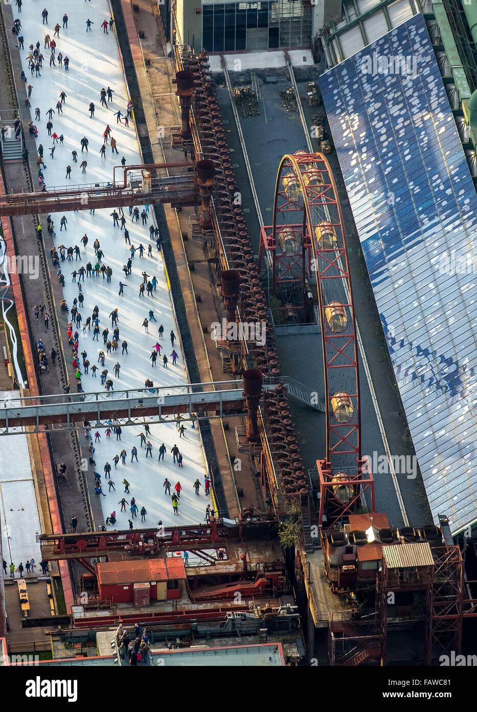 Skating rink in the coking plant Zollverein colliery with sun wheel at ...