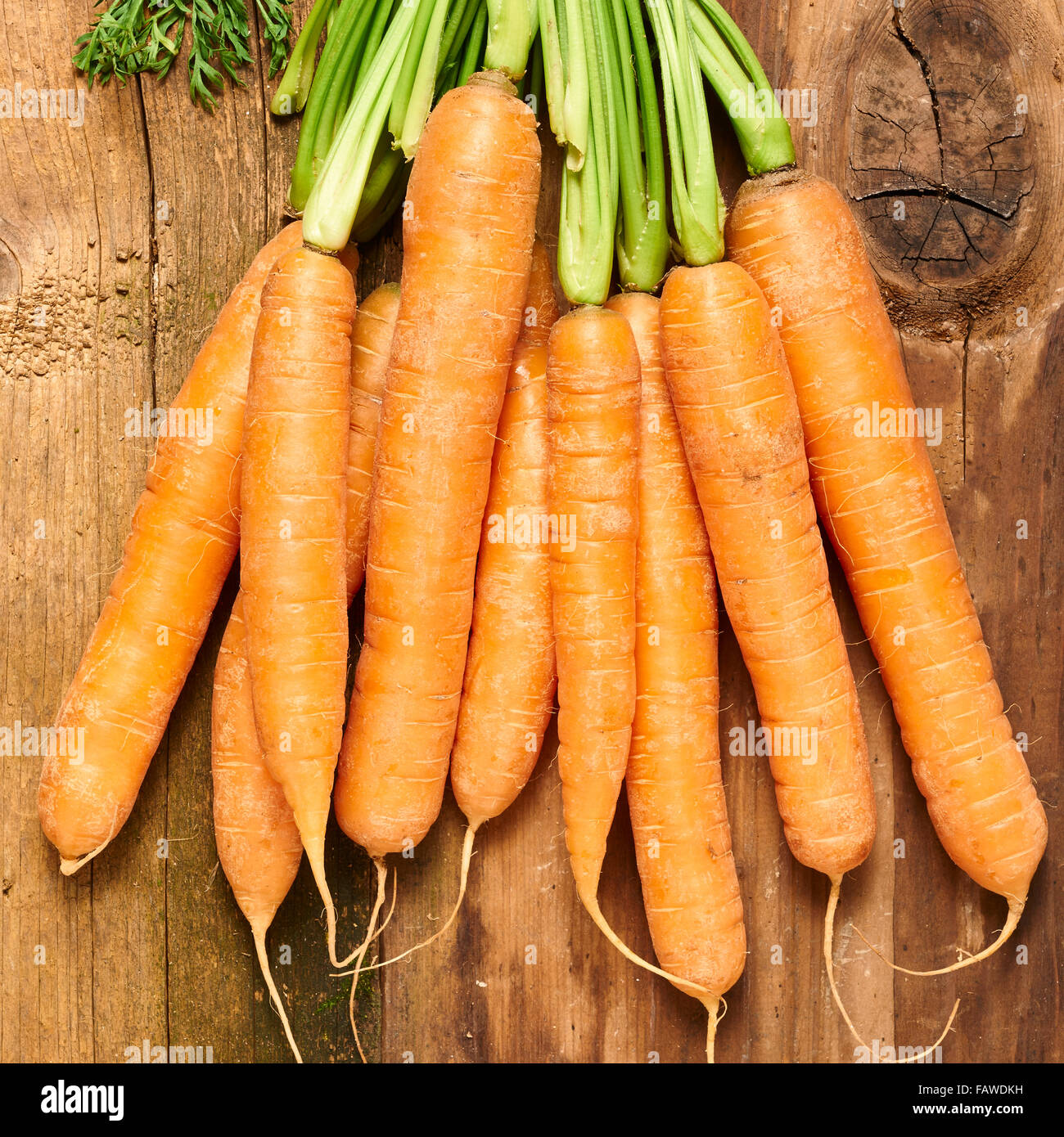 Group of delicious carrots on an old wooden table Stock Photo - Alamy