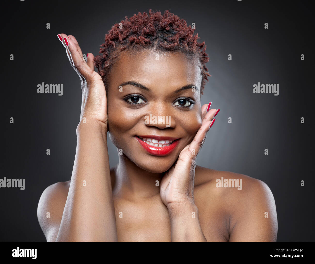 Black beauty with short spiky red hair Stock Photo - Alamy