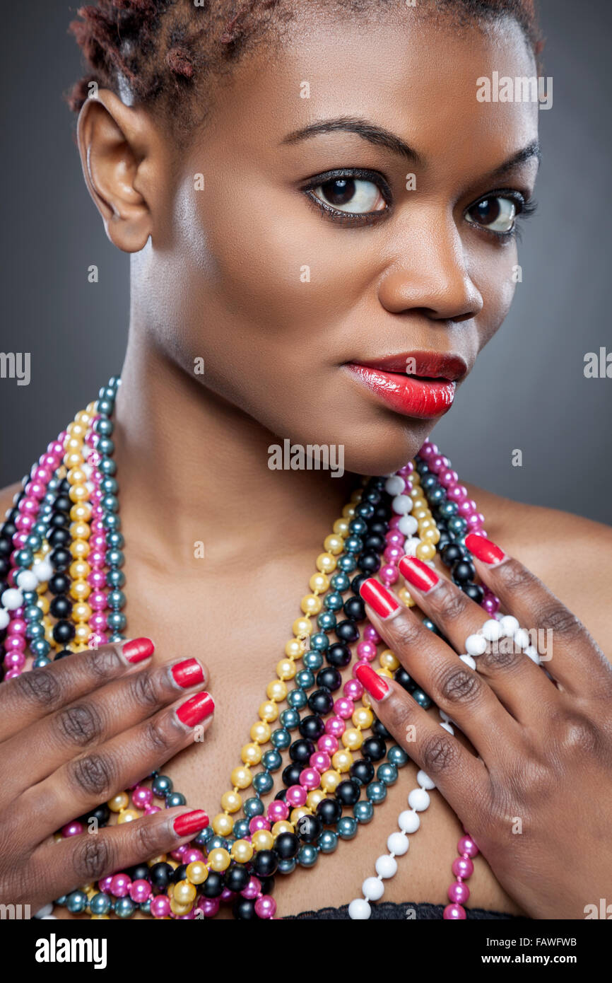 Black beauty with short spiky red hair Stock Photo - Alamy