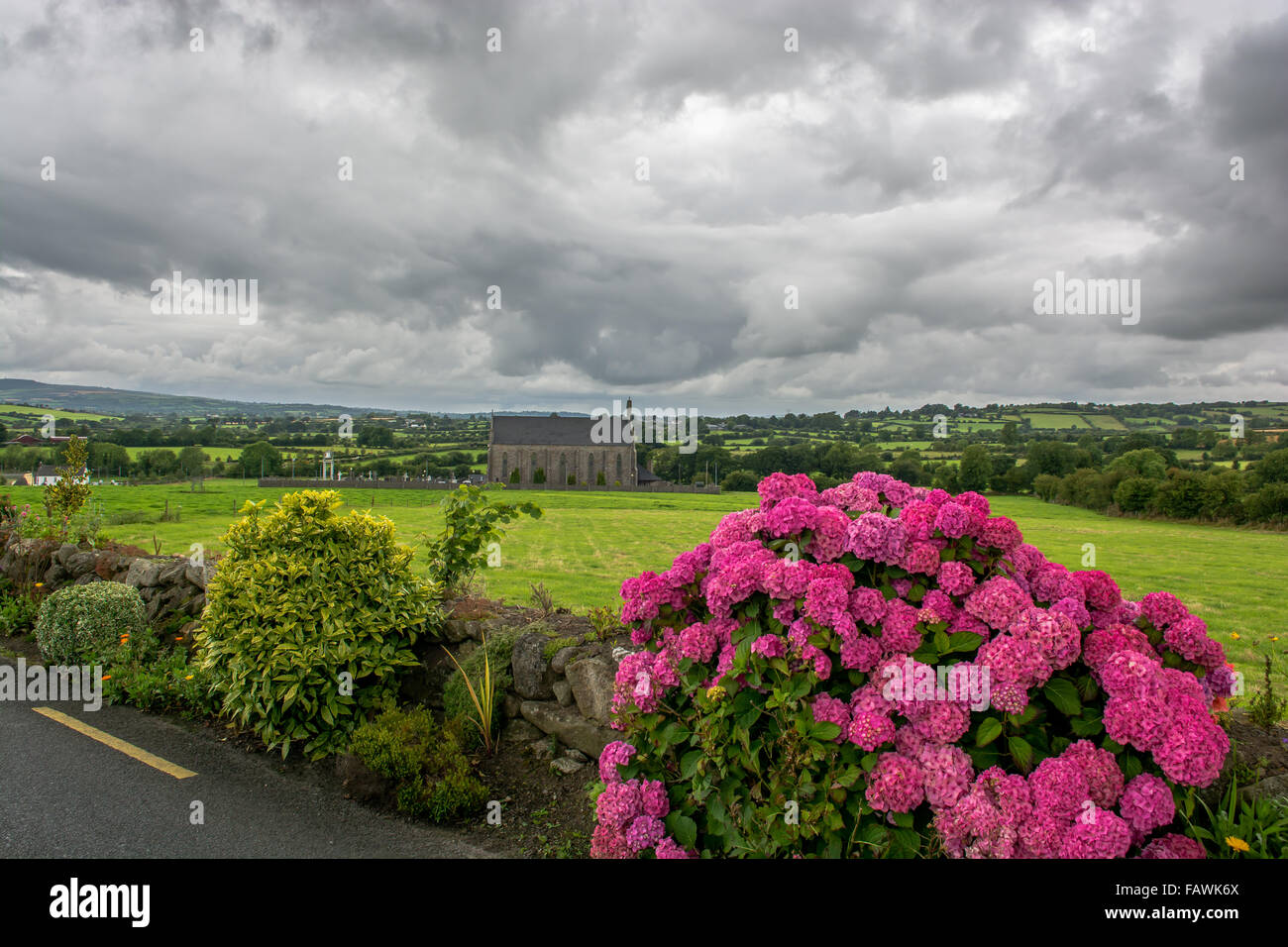Flowers and Church in Ireland Stock Photo - Alamy