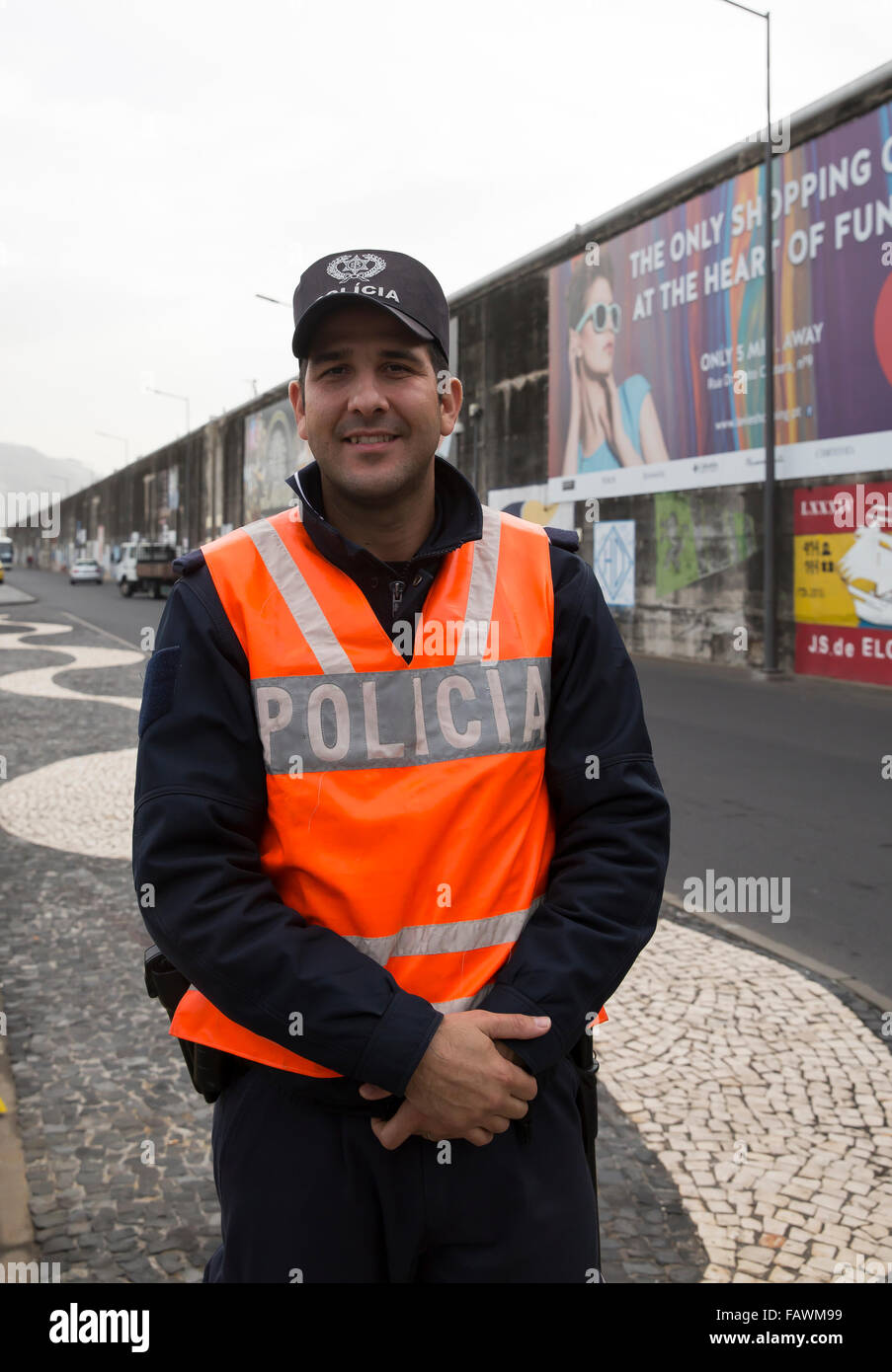 Police officer in a high vis jacket at the port gates of Madeira's ...