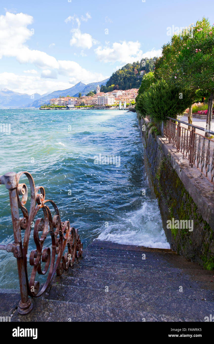 Wind sends Lake Como water splashing against a waterfront staircase and ...