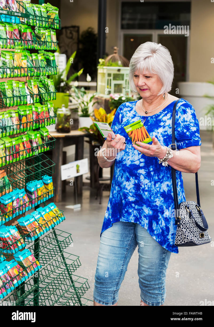Senior citizens shopping in mall hi-res stock photography and images ...