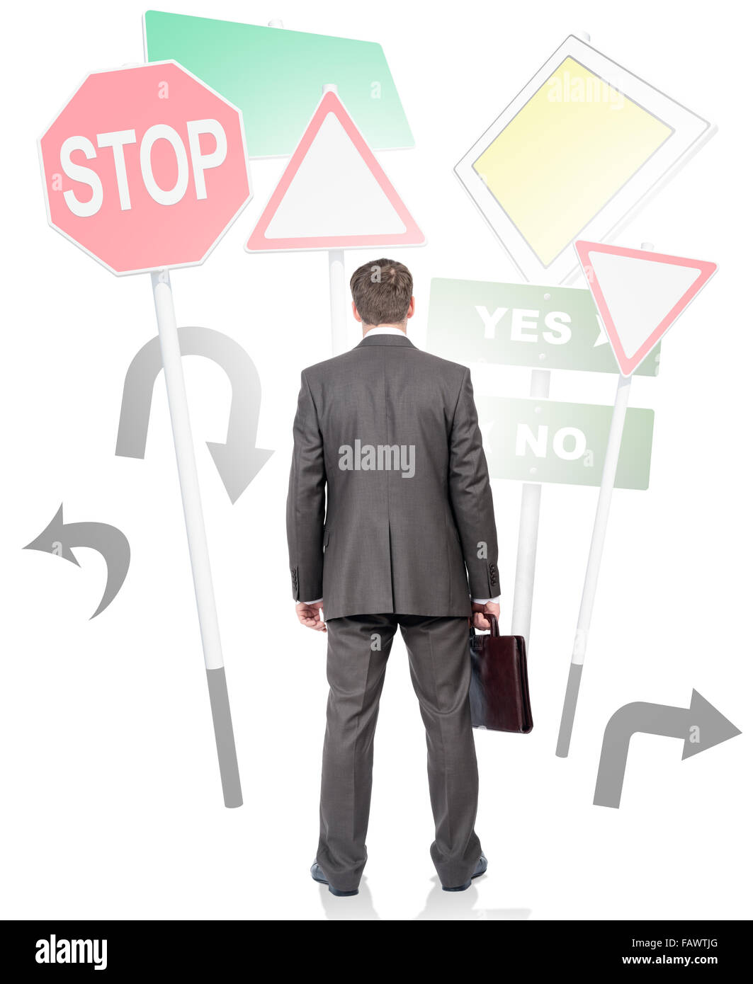 Businessman standing in front of road signs Stock Photo - Alamy