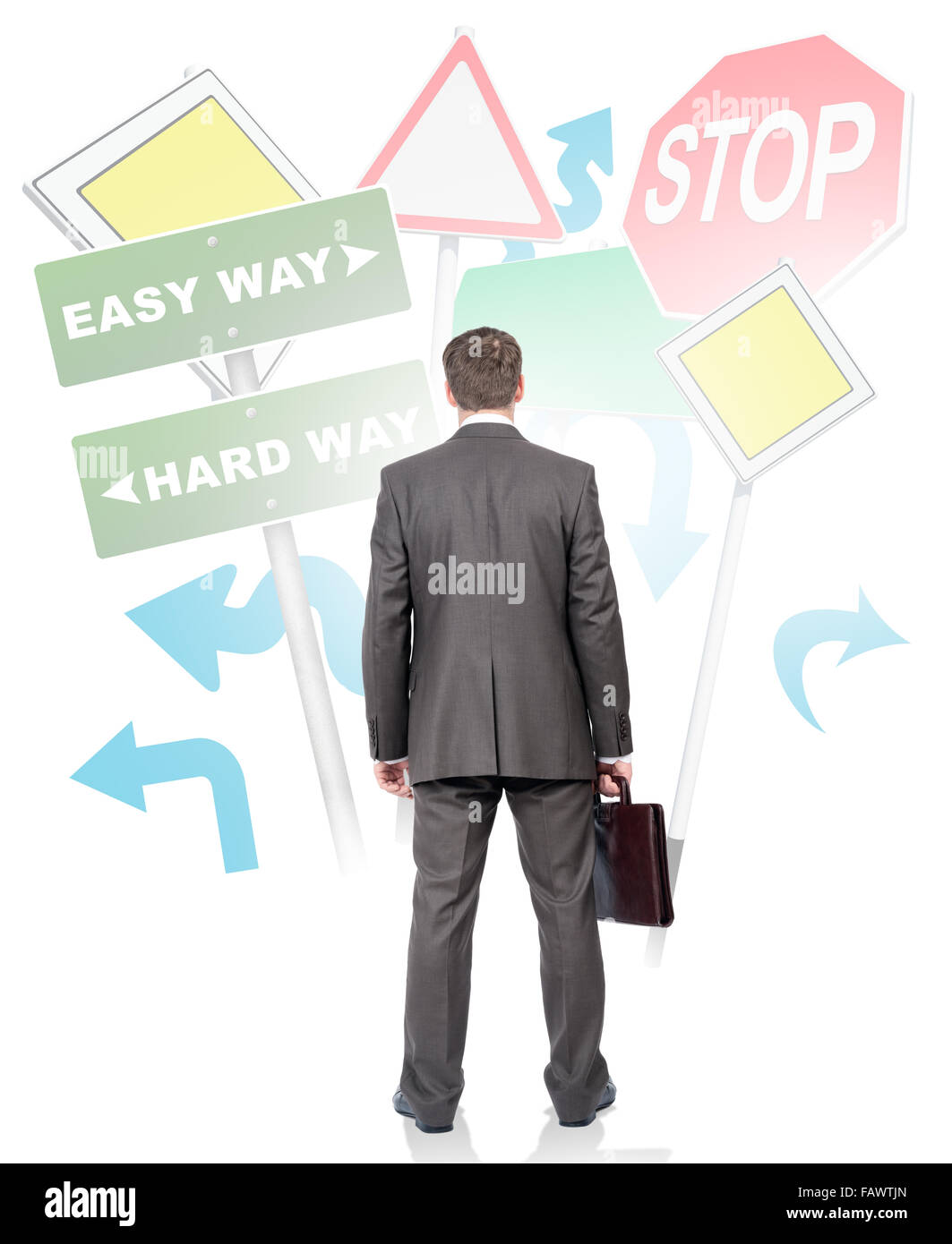 Businessman standing in front of road signs Stock Photo - Alamy