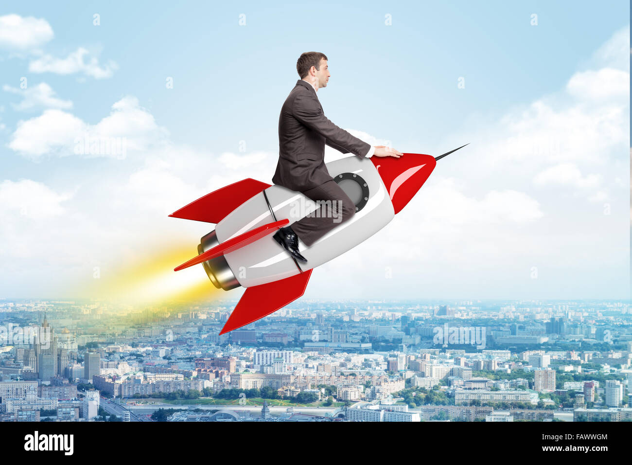 Businessman flying on rocket Stock Photo - Alamy