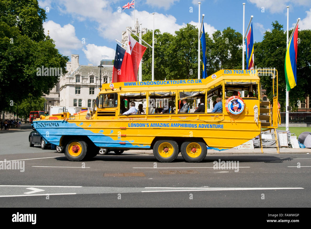 A London Duck Tours amphibious vehicle full of tourists in Parliament ...