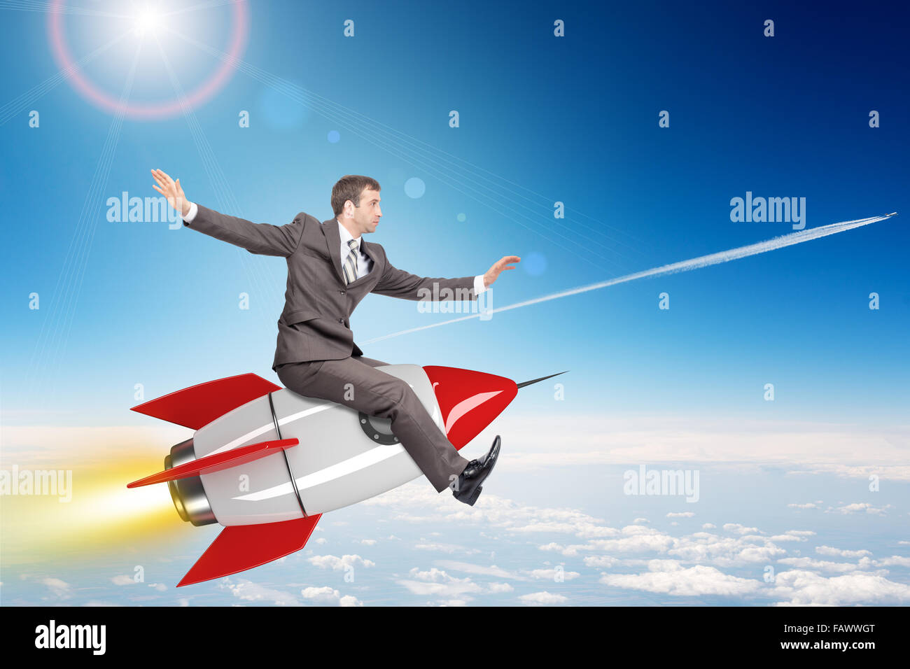 Businessman flying on rocket Stock Photo - Alamy
