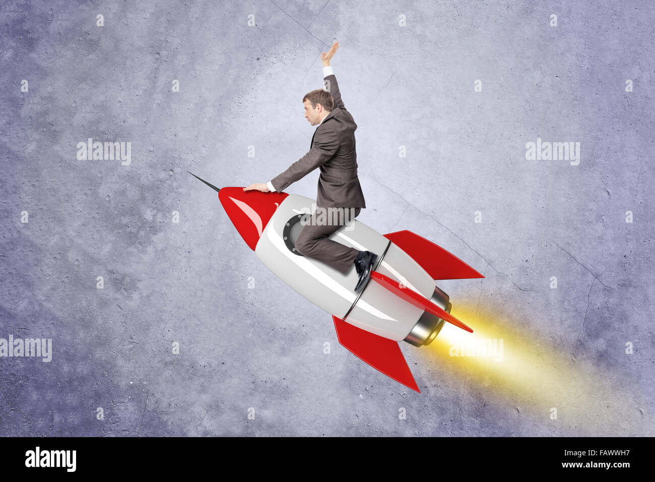 Businessman flying on rocket Stock Photo - Alamy