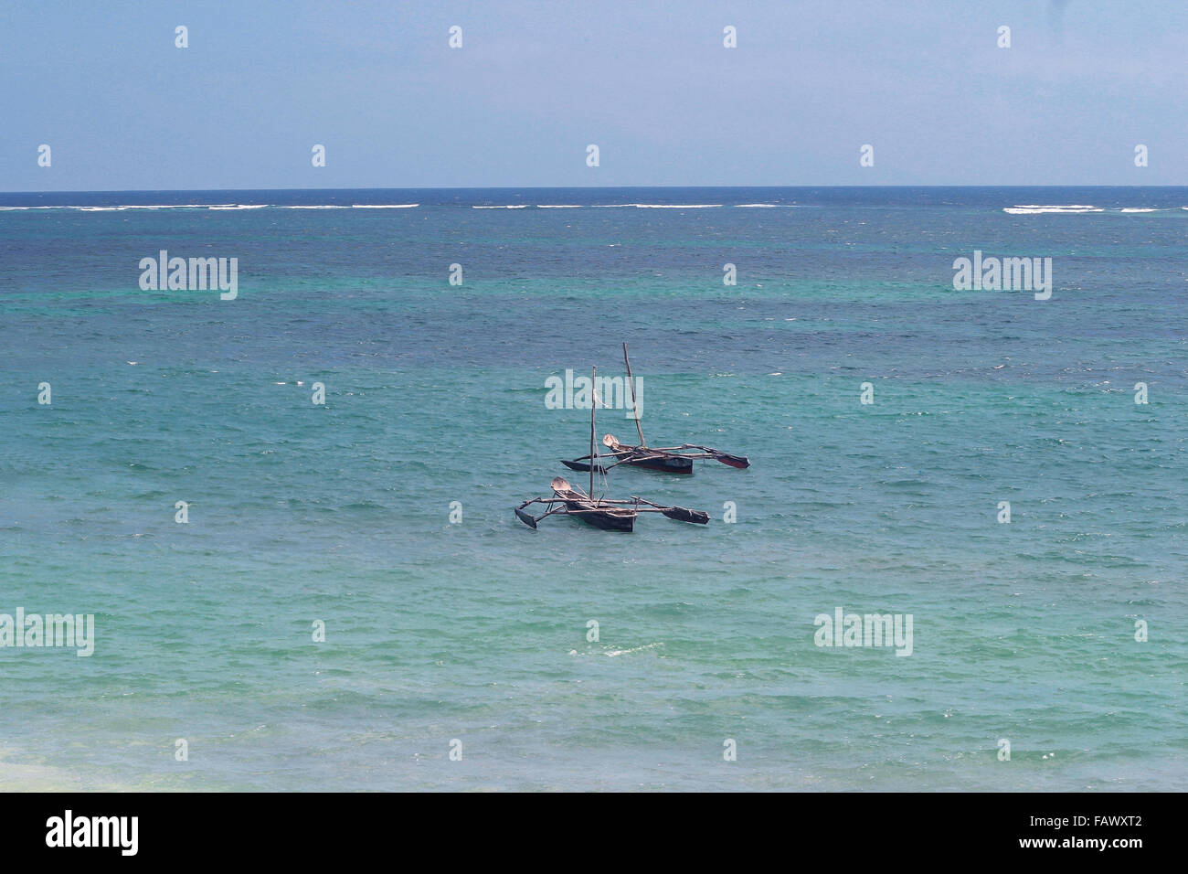 Two boats in turquoise tropical sea, blue sky, Mombasa, Kenya Stock ...