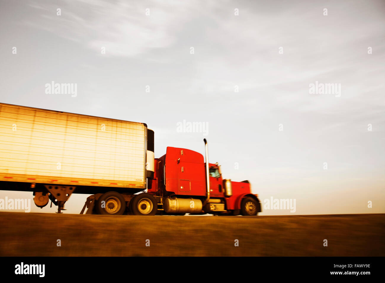 Tractor trailer on highway Stock Photo - Alamy